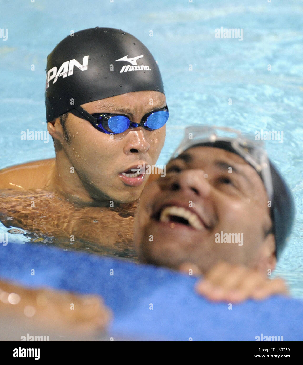 IRVINE, United States - Japan's Kosuke Kitajima (L) catches his breath ...