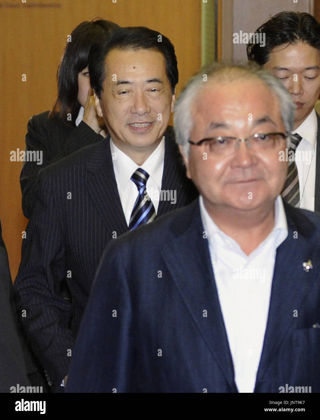 TOKYO, Japan - Prime Minister Naoto Kan (C) meets Nobuaki Koga (front ...
