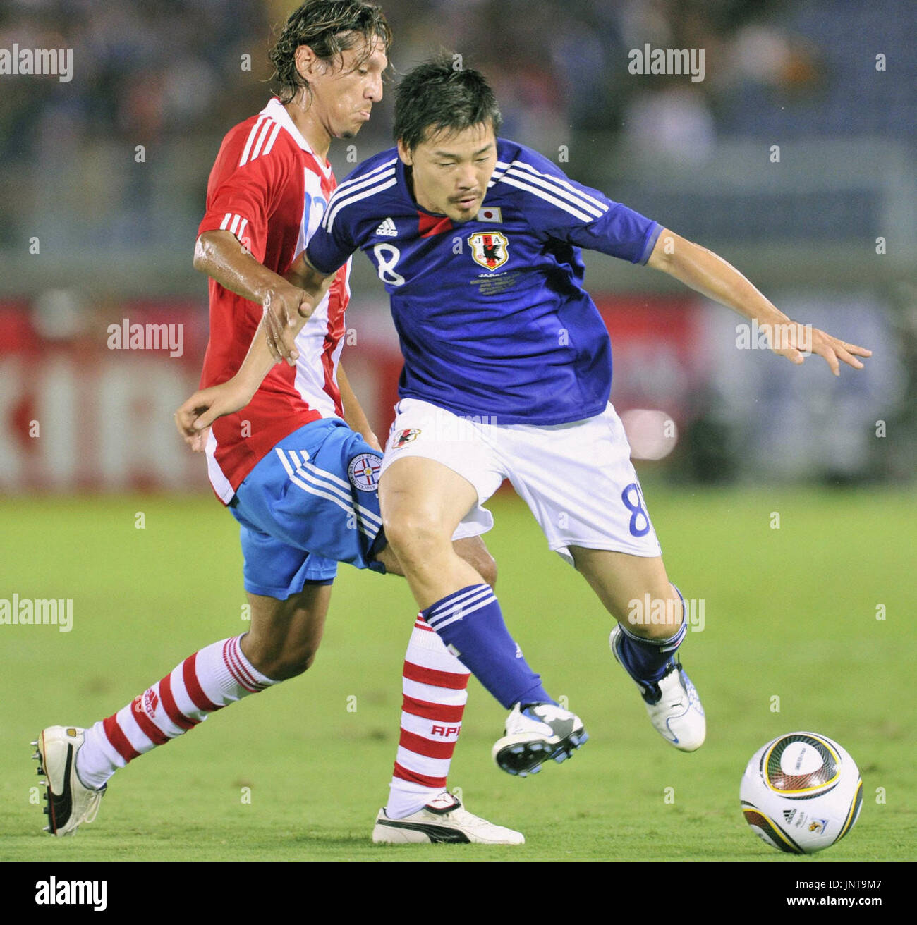 YOKOHAMA, Japan - Japan midfielder Daisuke Matsui (R) in action during ...