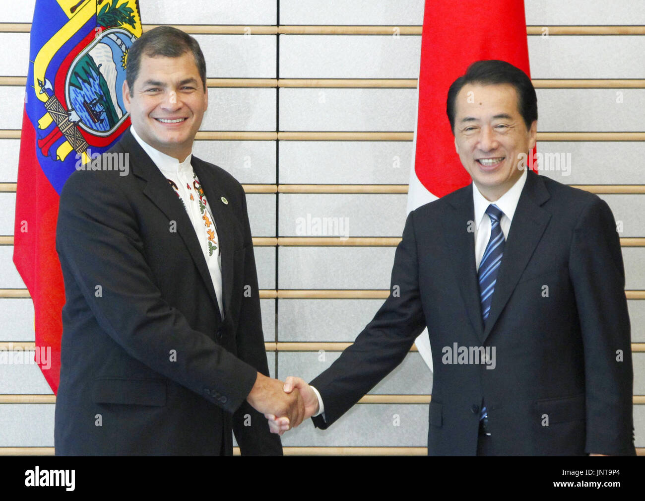 TOKYO, Japan - Ecuadorian President Rafael Correa (L) shakes hands with ... TOKYO, Japan - Ecuadorian President Rafael Correa (L) shakes hands with ...