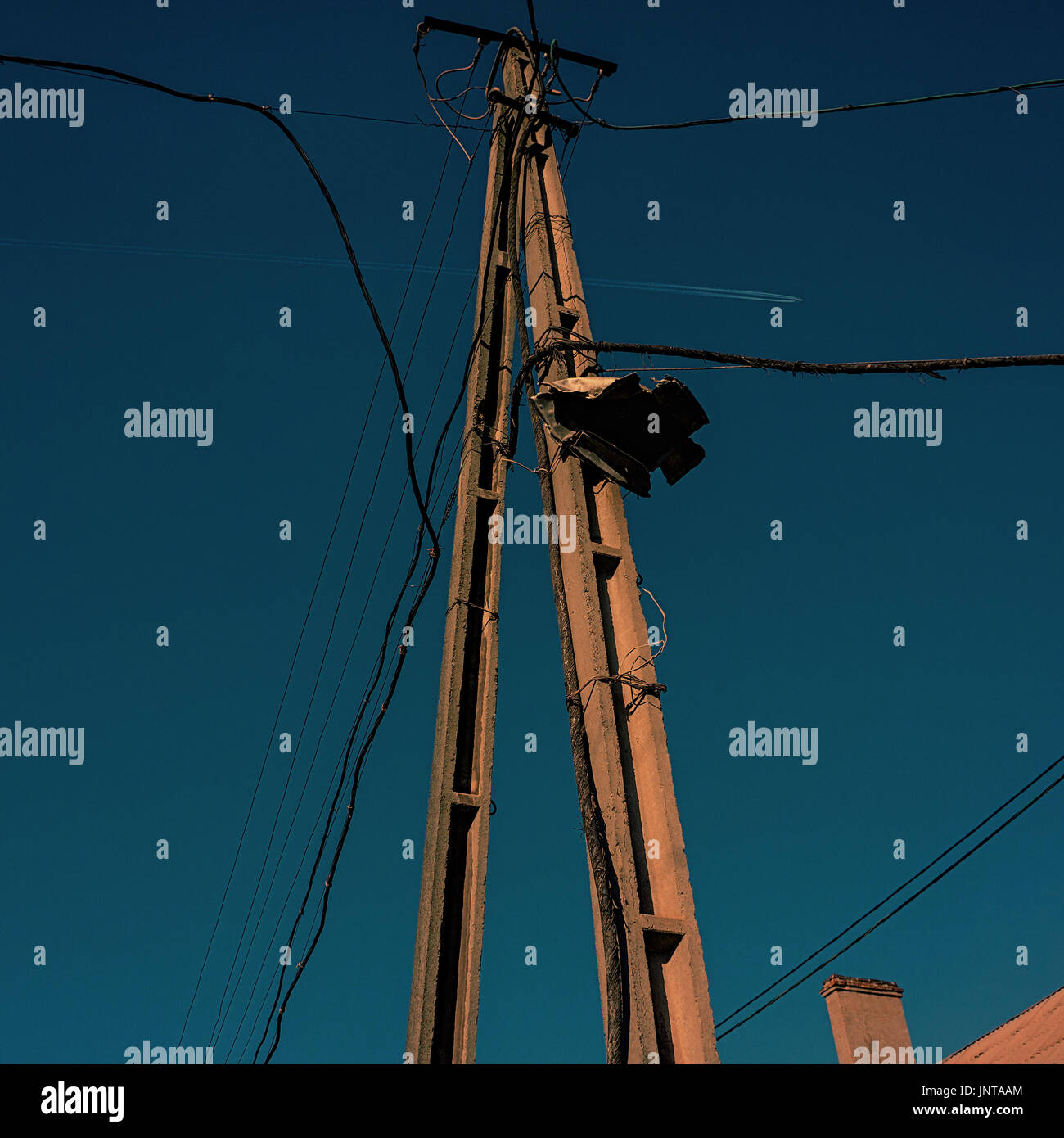 Pole of the power lines of communications on a blue sky background ...