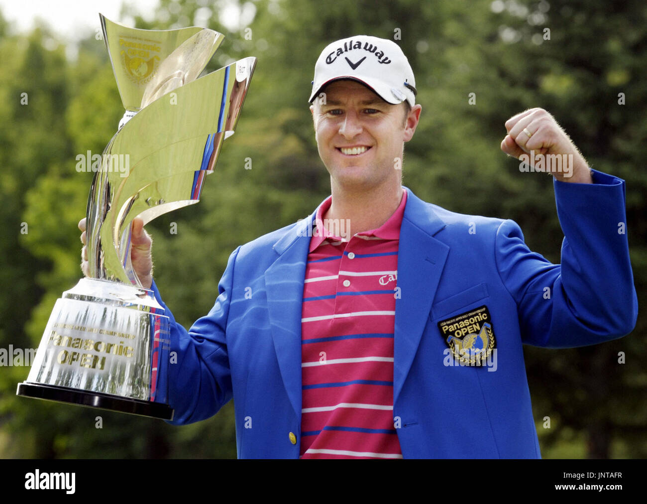 KOBE, Japan - Australia's Brendan Jones holds the winner's trophy after ...