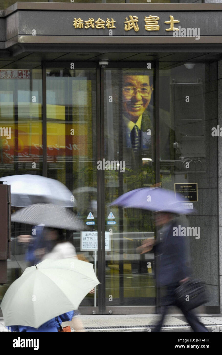 TOKYO, Japan - A large portrait of the late founder Yasuo Takei is seen ...