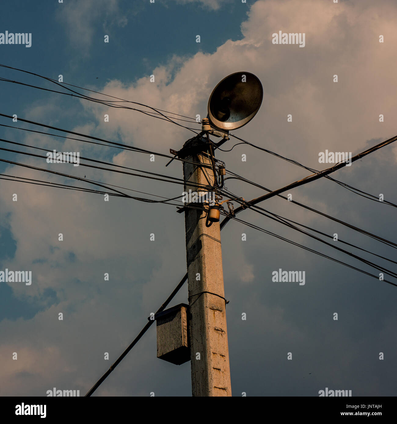 Pole of the power lines of communications on a blue sky background ...