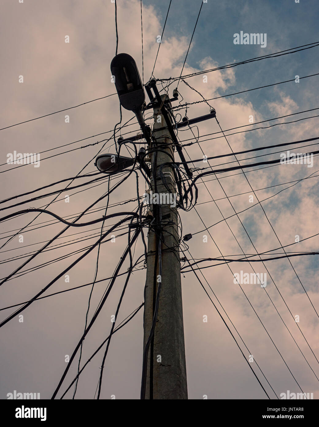 Pole of the power lines of communications on a blue sky background ...
