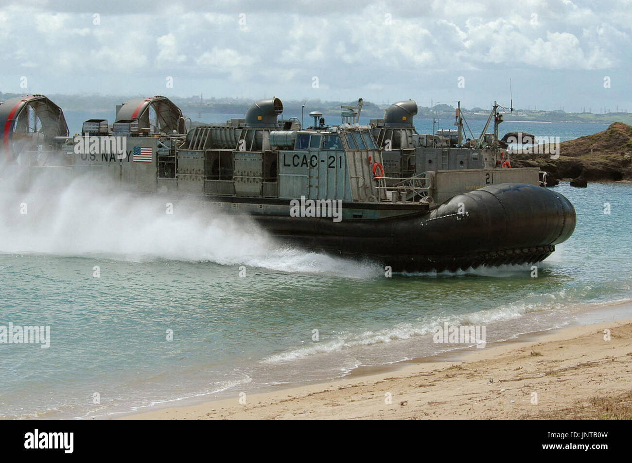 NAHA, Japan - A U.S. forces hovercraft lands on the beach of Kin Blue ...