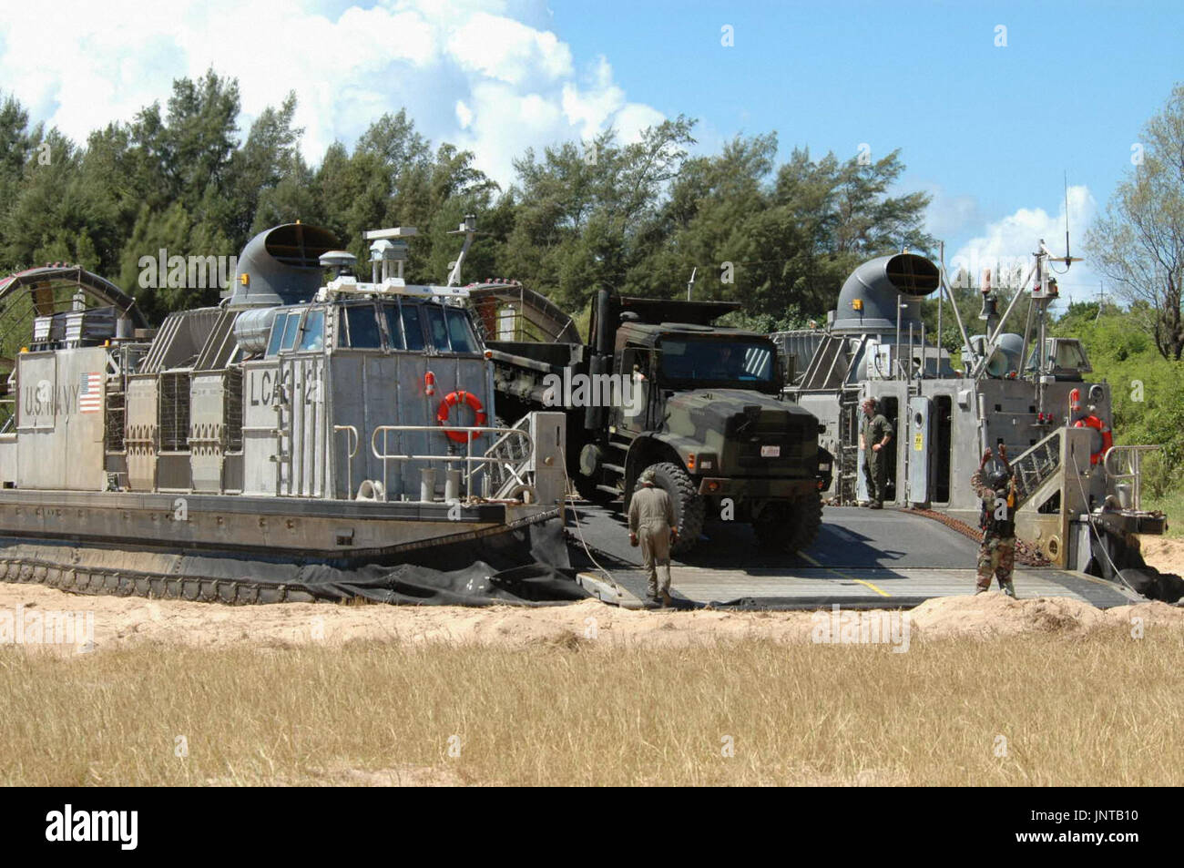NAHA, Japan - The U.S. 31st Marine Expeditionary Unit loads a truck ...