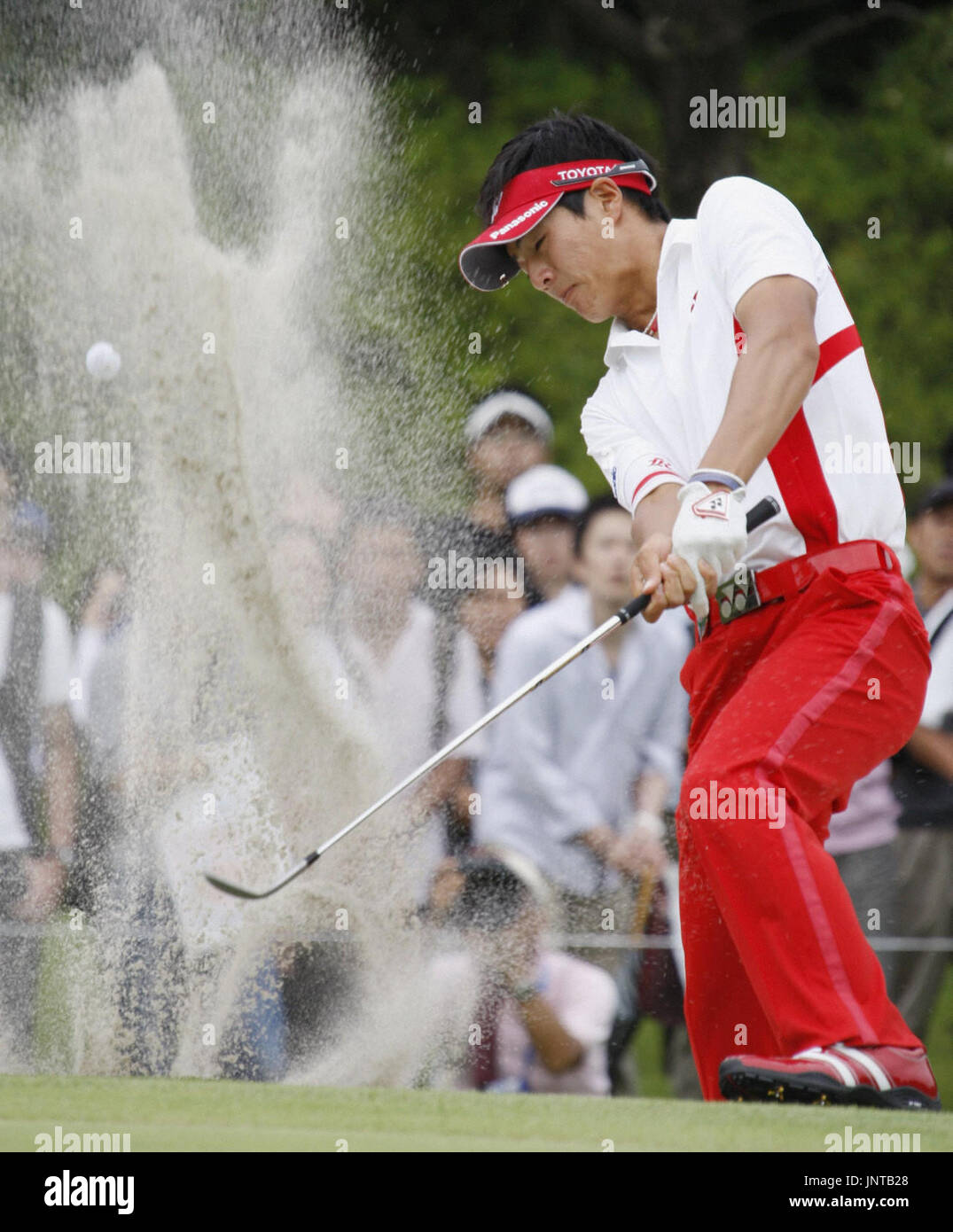 MIYOSHI, Japan - Ryo Ishikawa blasts a ball out of a bunker on the 7th hole in Miyoshi Country ...