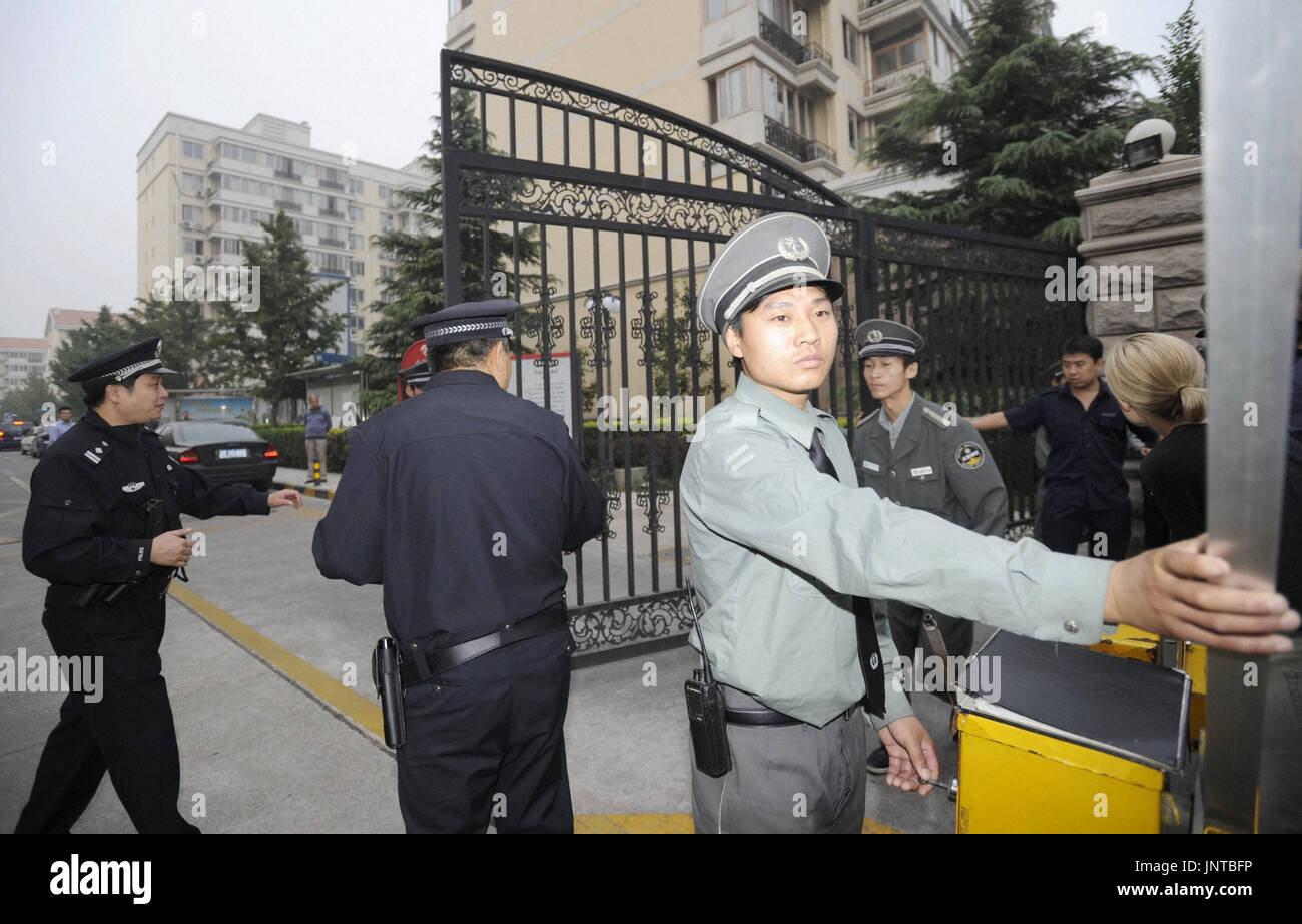 BEIJING, China - Police officers close the gate to the home of Liu Xia, the wife of Nobel Peace ...