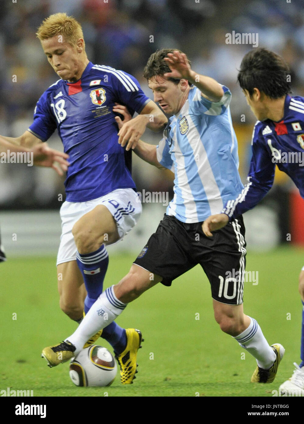 SAITAMA, Japan - Argentina star striker Lionel Messi (C) and Japan ...