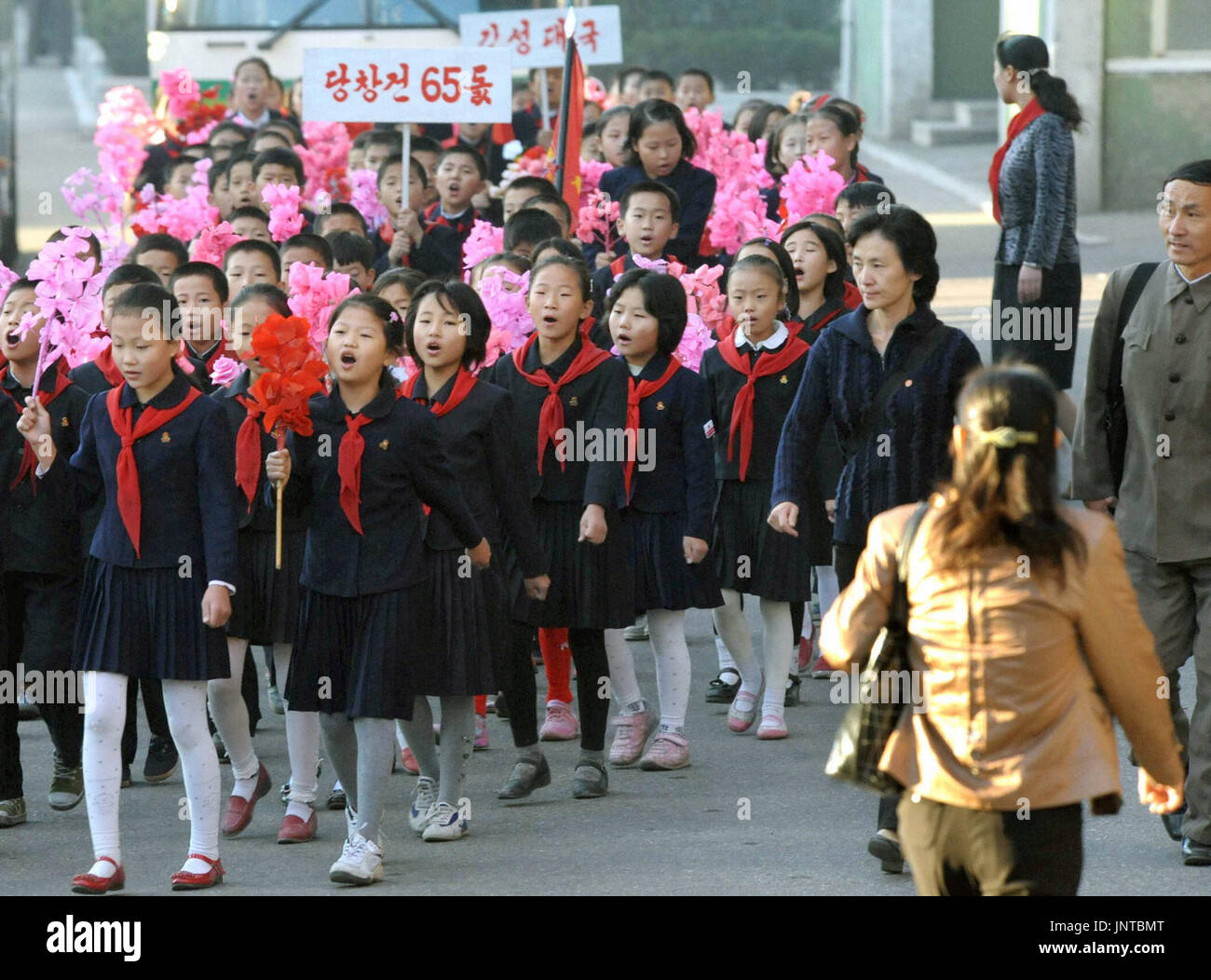 PYONGYANG, North Korea - Elementary school students march chanting the ...