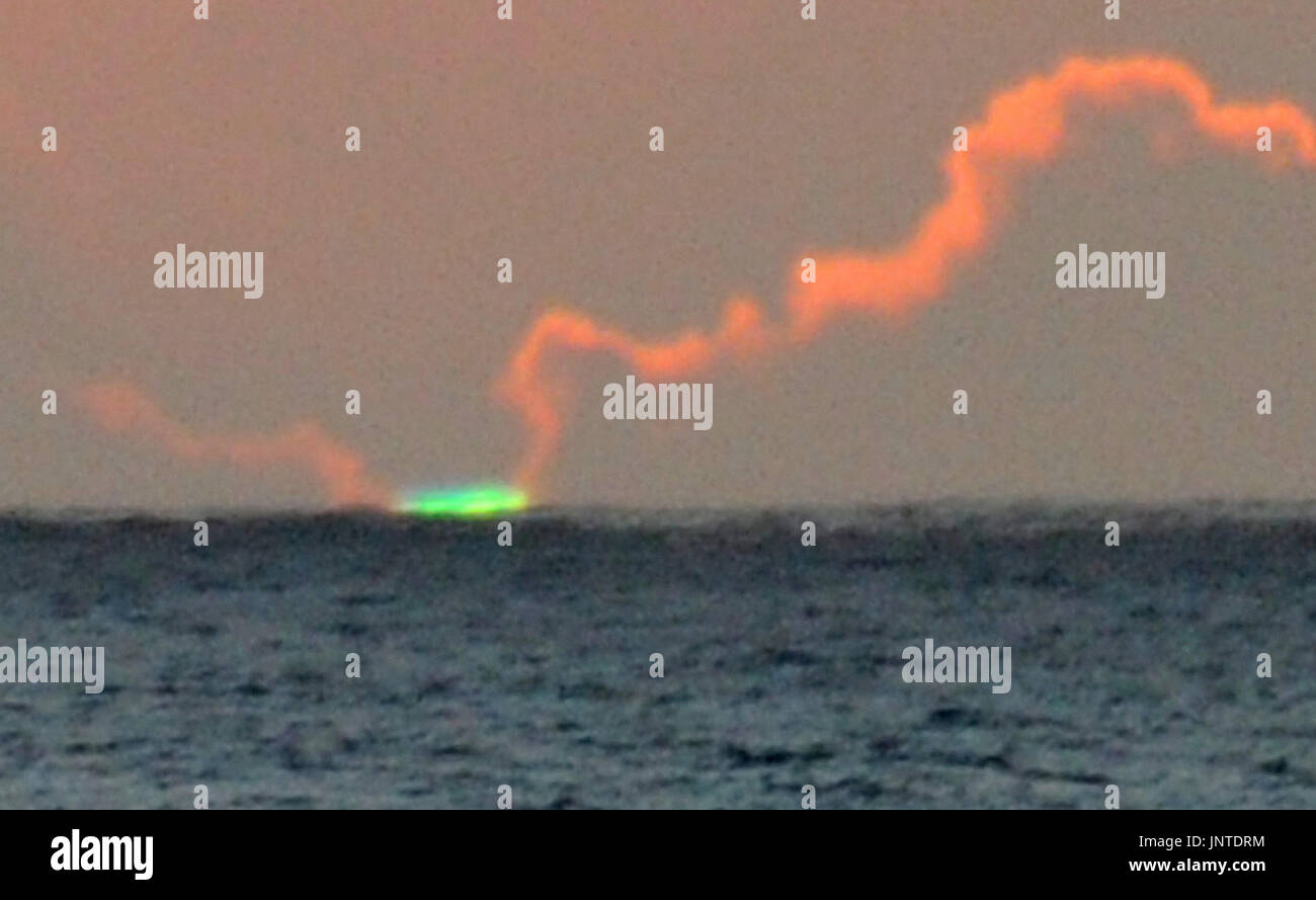 TOKYO, Japan - CORRECTED AS THIS IS A POOL PHOTO A green flash appears ...