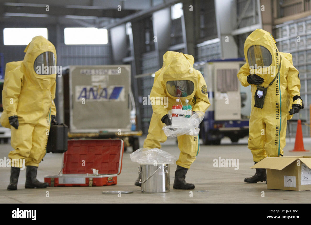NARITA, Japan - Riot police officers in protective suits dispose of ...