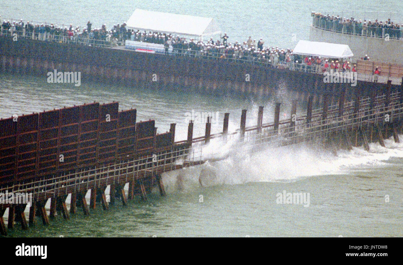 TOKYO, Japan - People watch a drainage gate closing on the Isahaya Bay ...