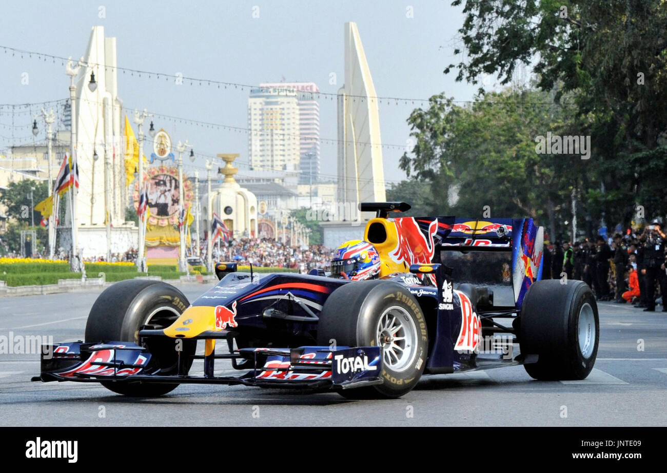 BANGKOK, Thailand - A Formula One racing car drives on a main street of ...