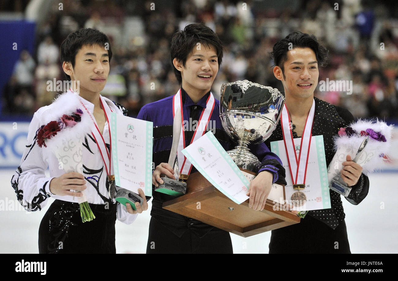 NAGANO, Japan - Takahiko Kozuka, (C), Nobunari Oda (L) and Daisuke Takahashi celebrate after ...