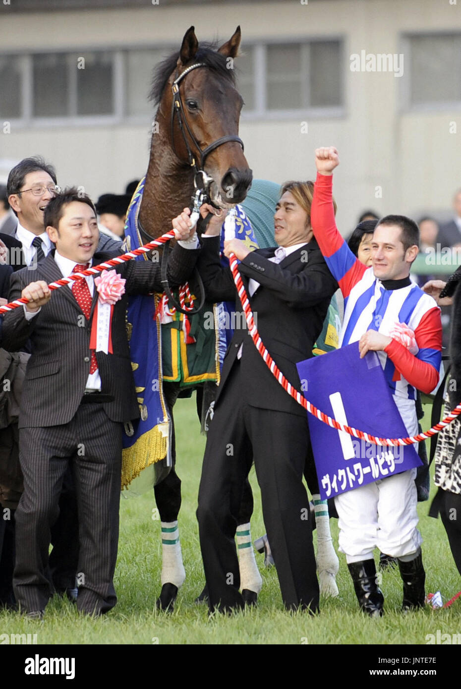FUNABASHI, Japan - Jockey Mirco Demuro (R) poses for photos near his ...