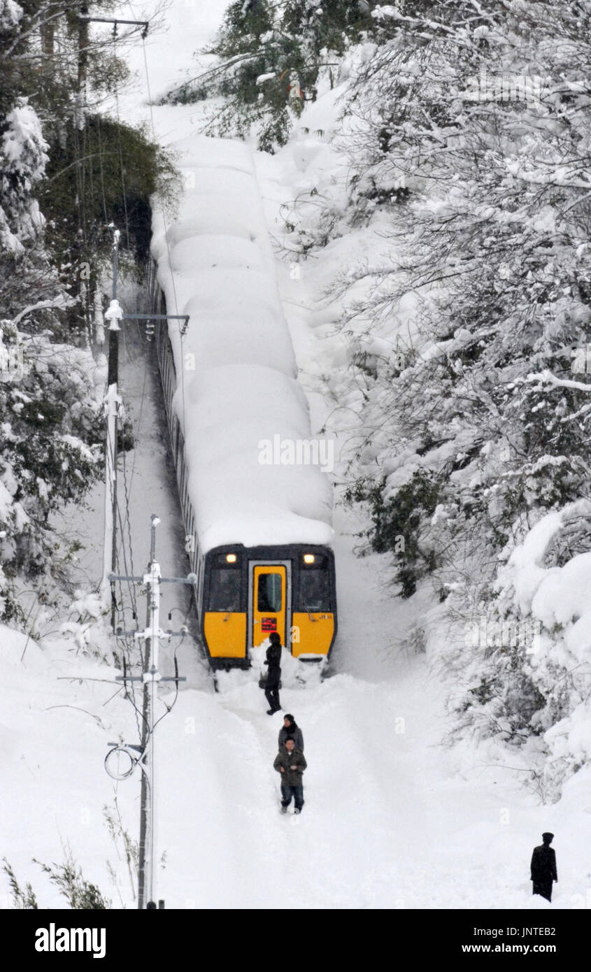 DAISEN, Japan - A train of West Japan Railway Co. is stranded in heavy ...