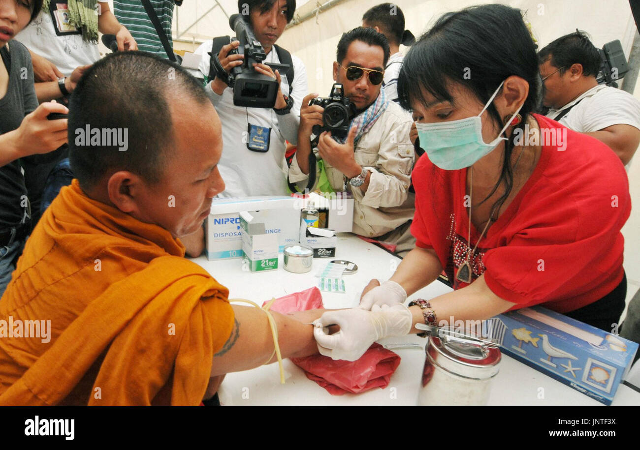 BANGKOK, Thailand - A Buddhist monk donates blood in Bangkok on Mary 16 ...