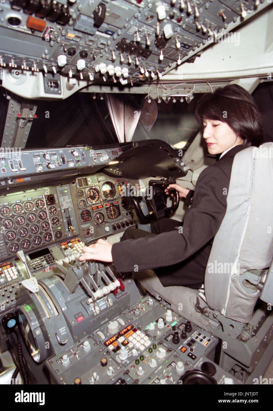 TOKYO, Japan - A trainee pilot operates a jumbo jet cockpit simulator ...