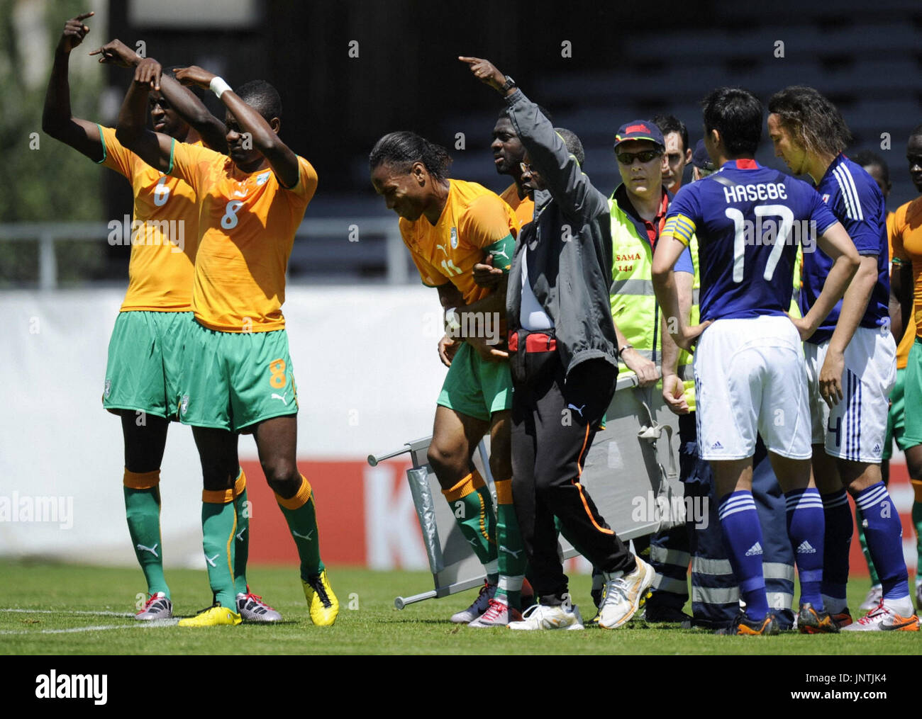 SION, Switzerland - Ivory Coast forward Didier Drogba (C) hobbles off ...