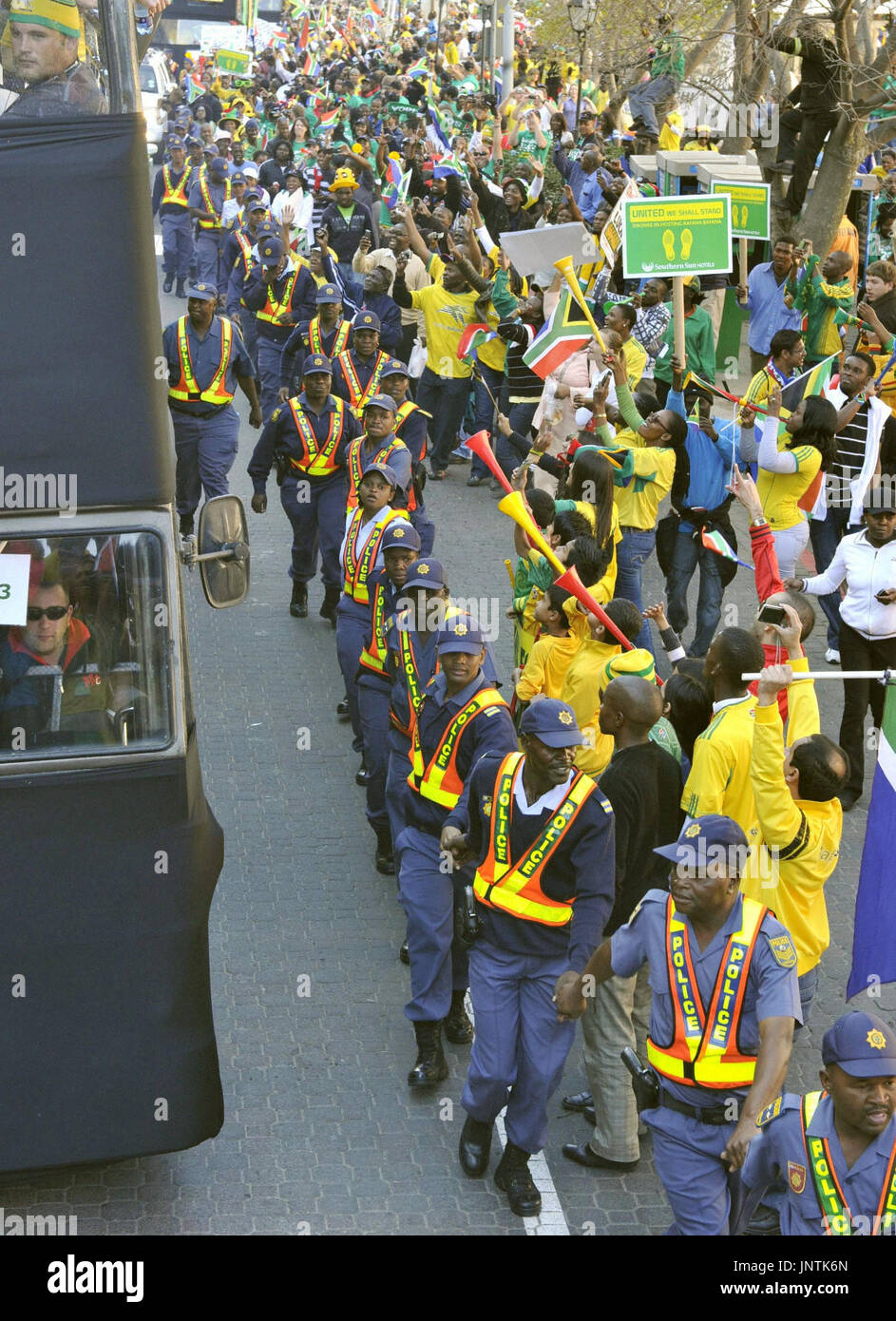 JOHANNESBURG, South Africa - Police officers stand guard along a street ...