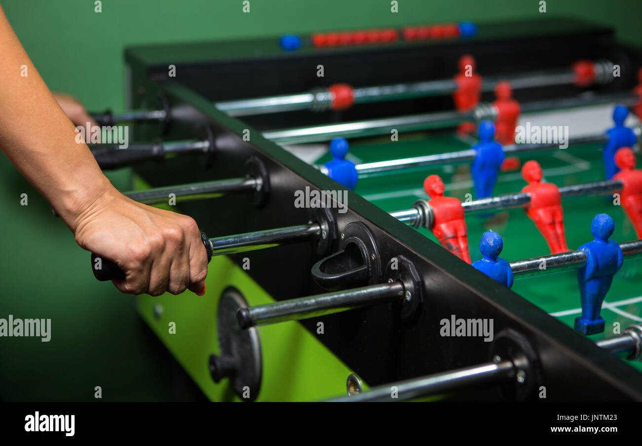 Table football with red and blue players Stock Photo - Alamy