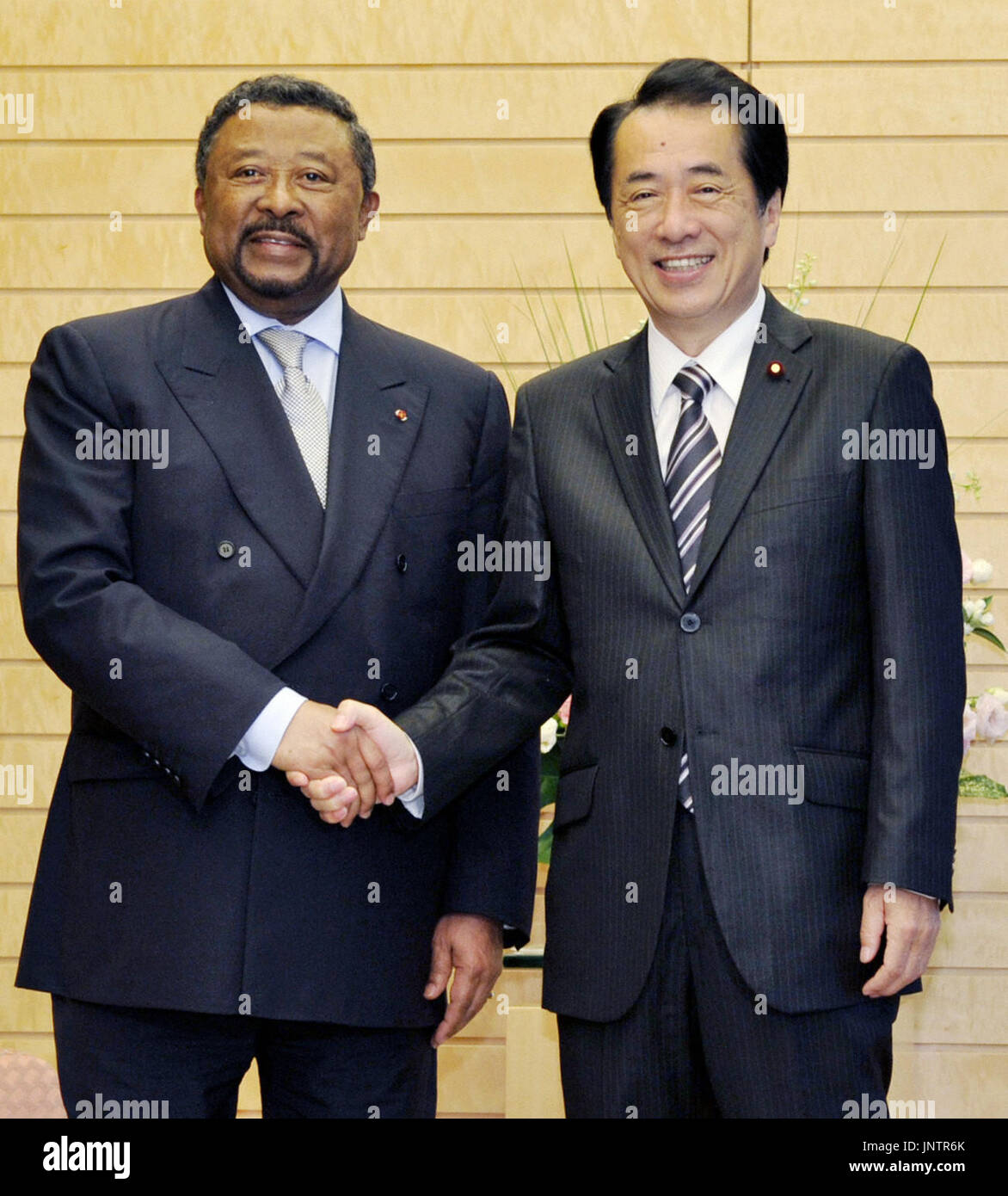 TOKYO, Japan - Prime Minister Naoto Kan (R) shakes hands with African ...