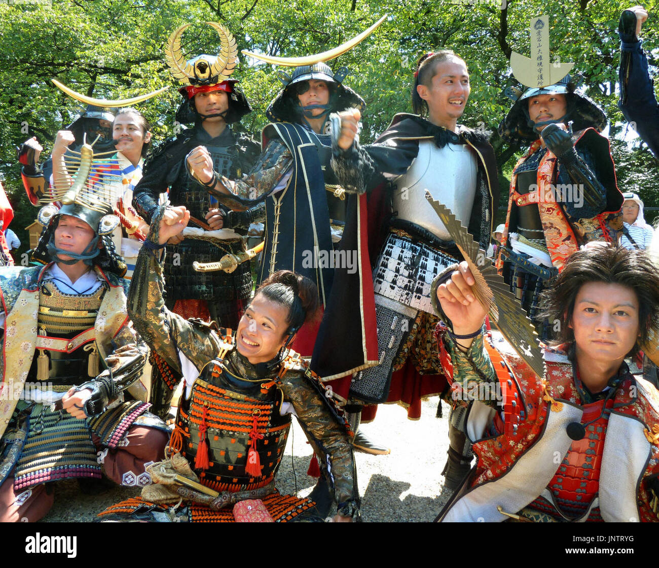 NAGOYA, Japan - Groups of men clad in traditional samurai armor pose ...