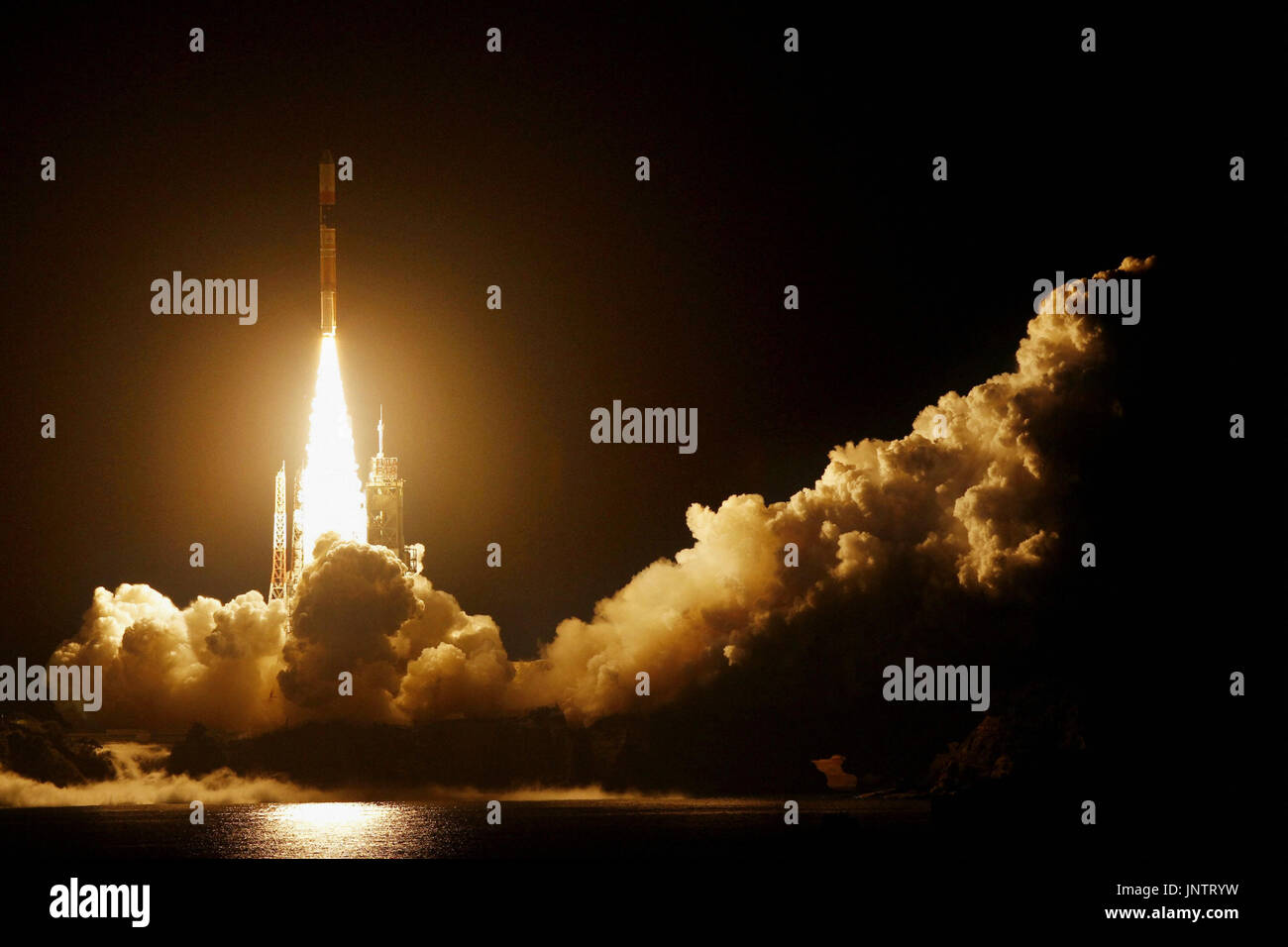 TANEGASHIMA, Japan - The H2A Launch Vehicle No. 18 with the first quasi ...