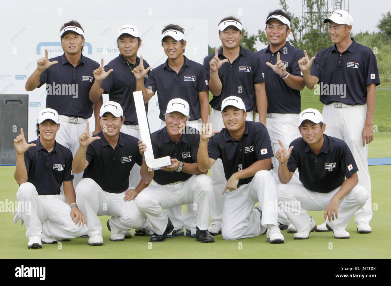 JEJU, South Korea - Members of the Japanese golf team pose for photos ...