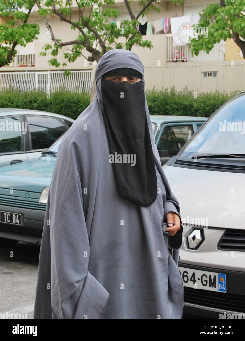 TOKYO, Japan - Photo shows Muslim woman Kenza Drider walking in Avignon ...