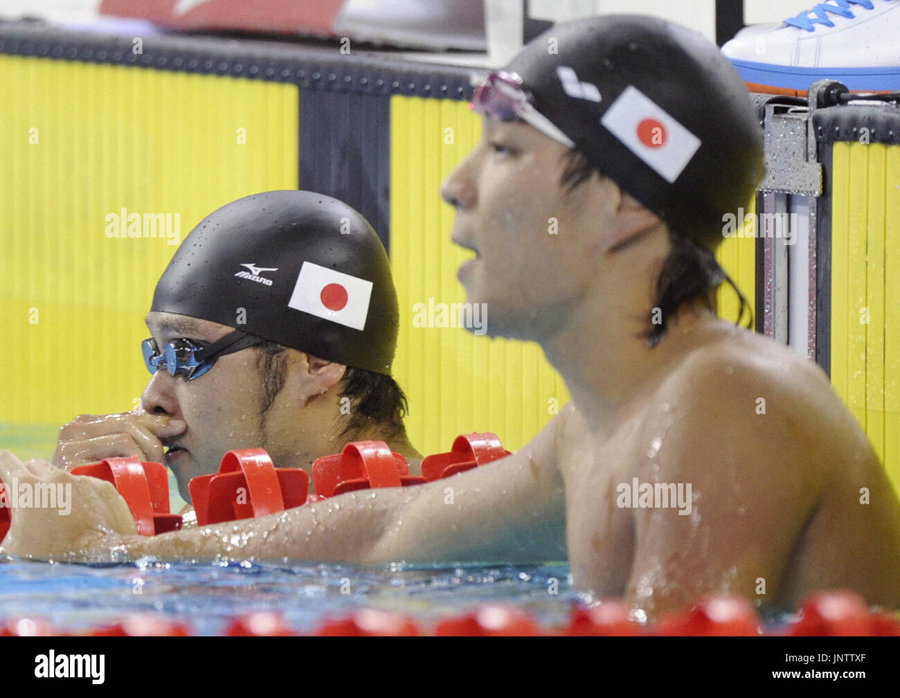GUANGZHOU, China - Japan's Ryo Tateishi (R) and Kosuke Kitajima finish second and fourth ...