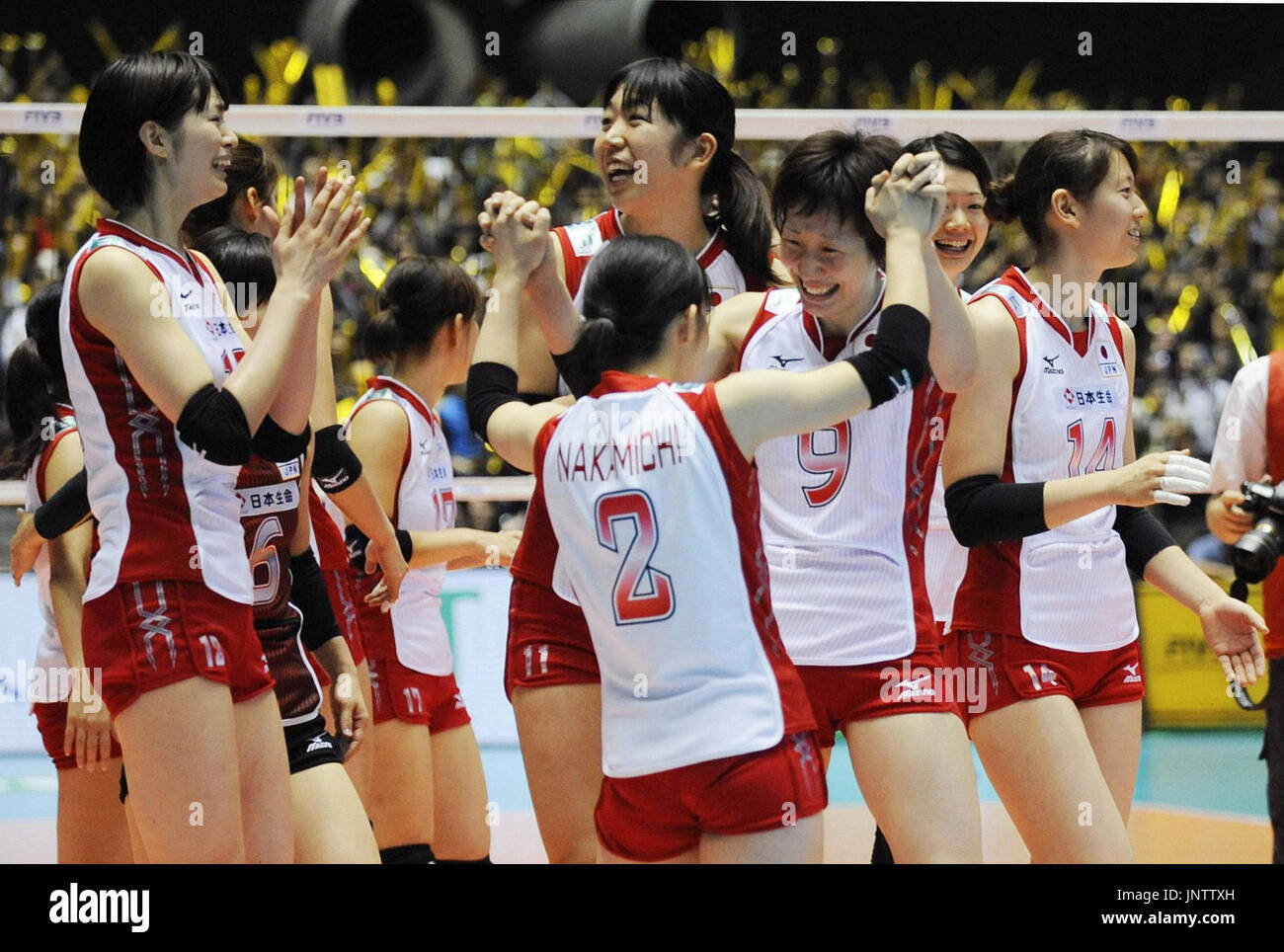 TOKYO, Japan - Members of the Japanese volleyball team celebrate after ...
