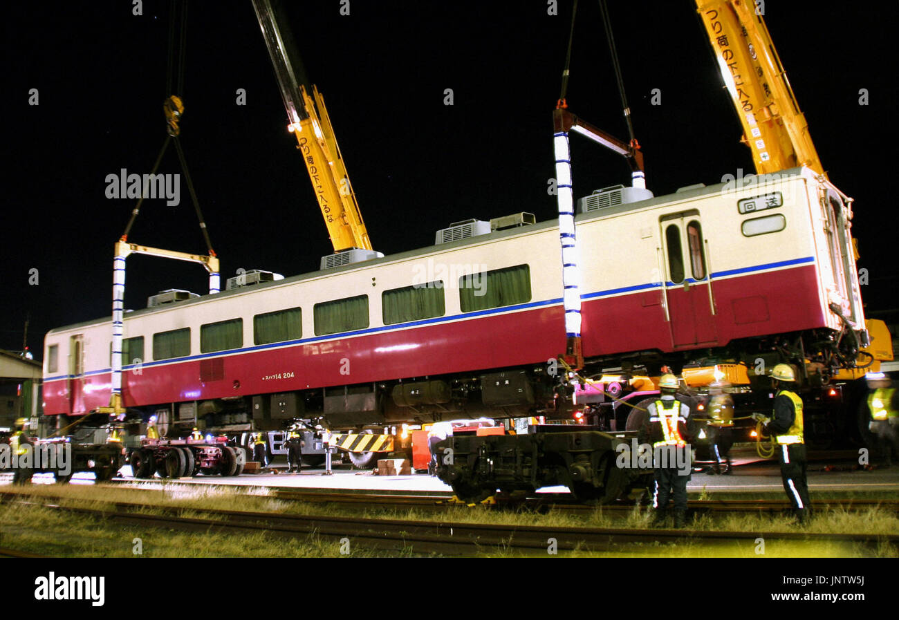 KITAKYUSHU, Japan - A retired Japanese train car is loaded onto a ...