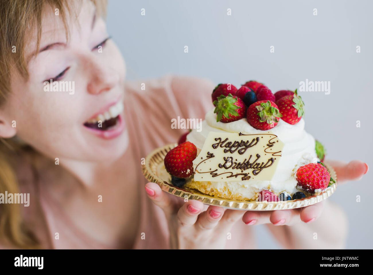 Woman posing birthday cake hi-res stock photography and images - Alamy