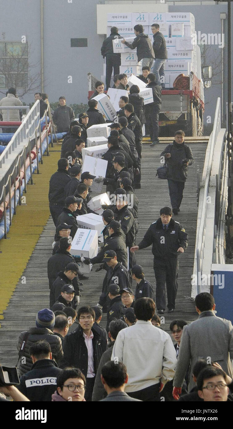 INCHEON, South Korea - Members of the South Korean maritime police load ...