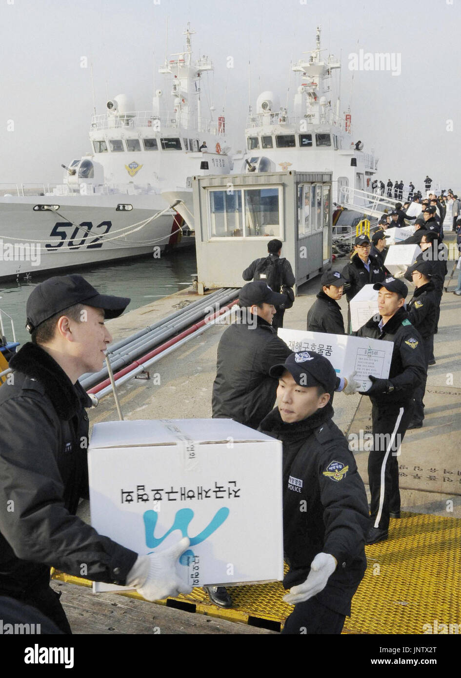 INCHEON, South Korea - Members of the South Korean maritime police load ...