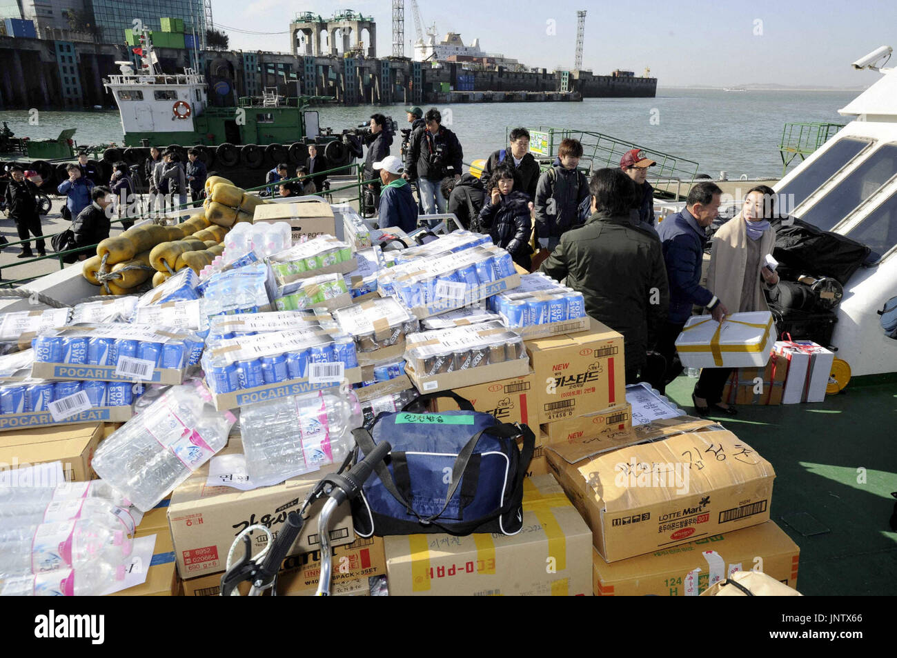 INCHEON, South Korea - Residents of Yeonpyeong Island board a ship at ...