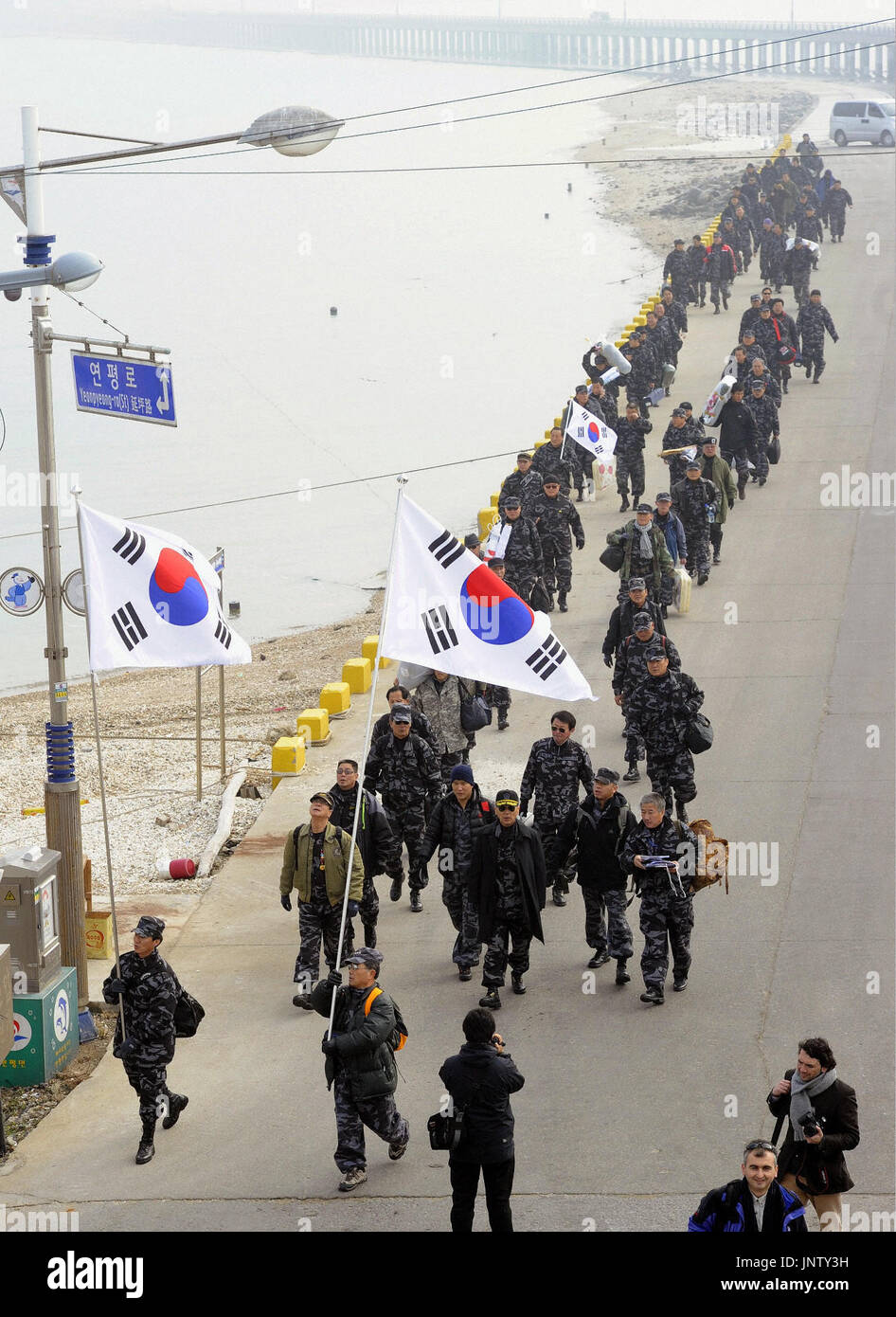 YEONPYEONG ISLAND, South Korea - A group of former South Korean ...