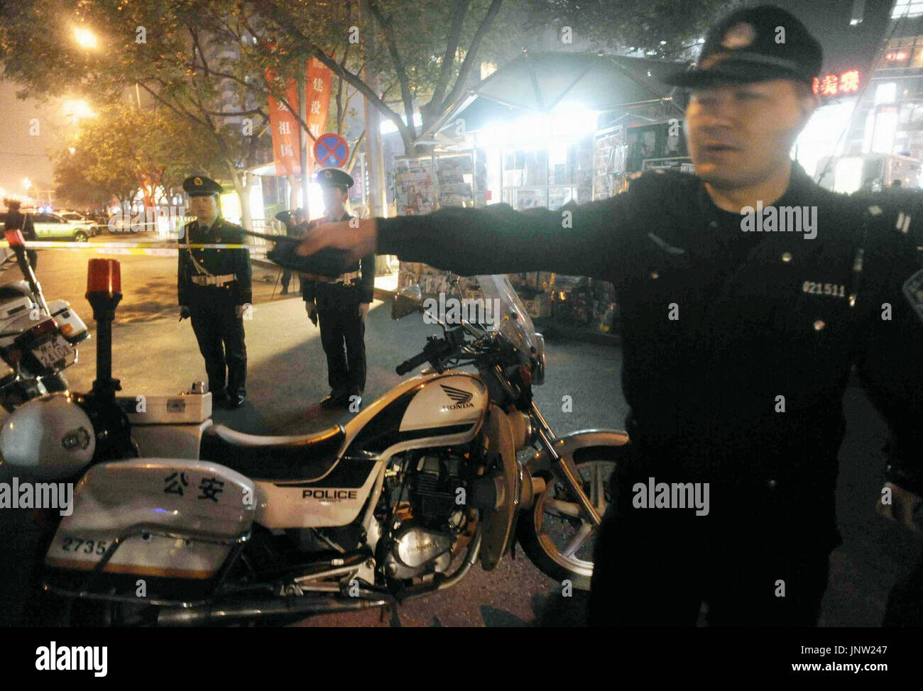 BEIJING, China - Police officers are on alert around Dongzhimen subway ...