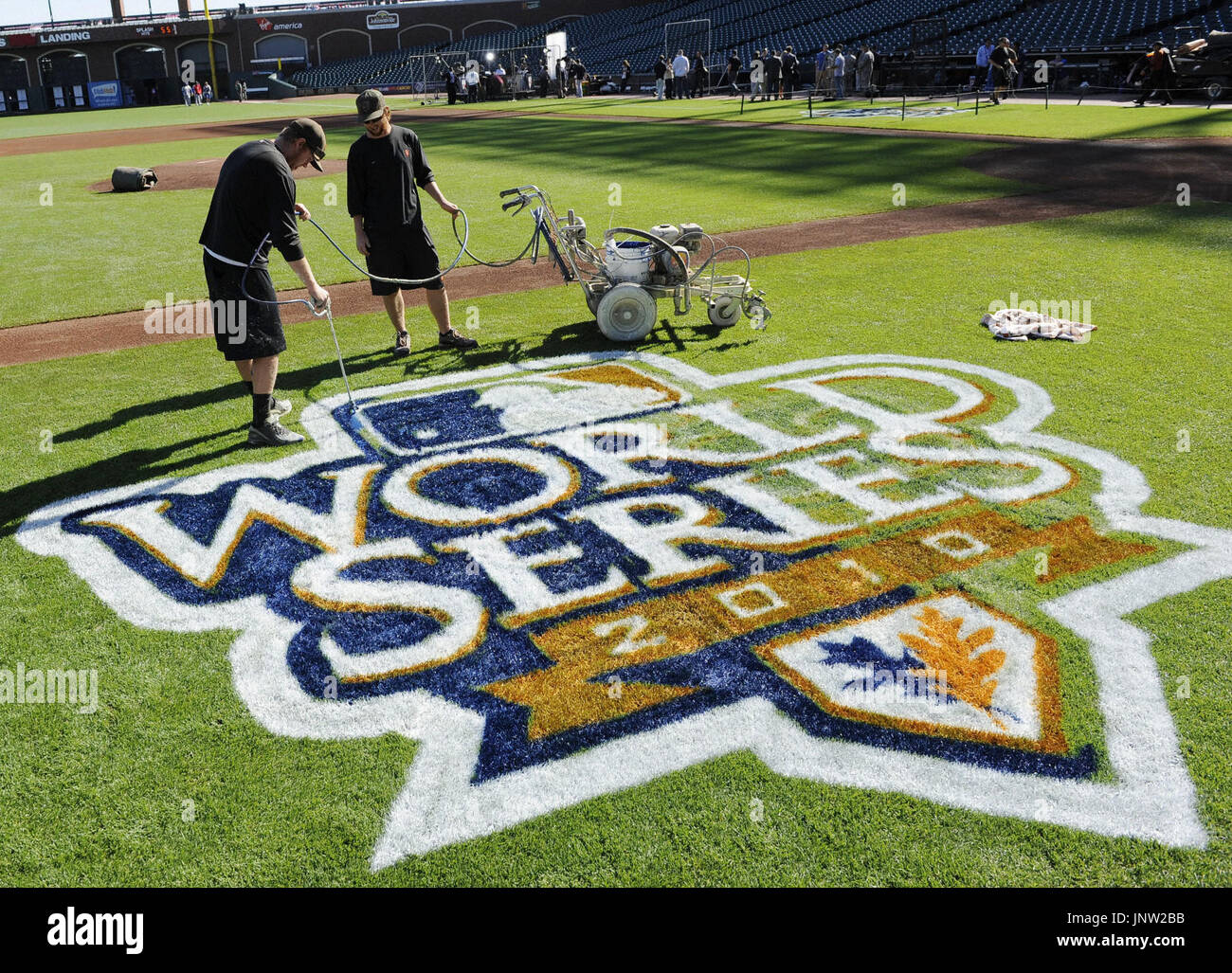 SAN FRANCISCO, United States - Workers paint a logo at AT&T Park in San ...