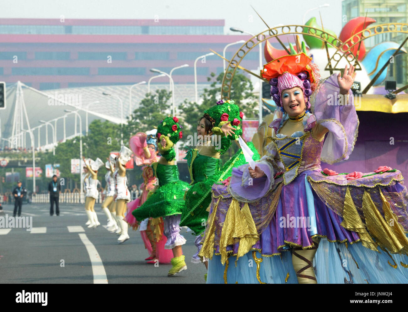 SHANGHAI, China - Dancers wave to the crowd giving their last ...