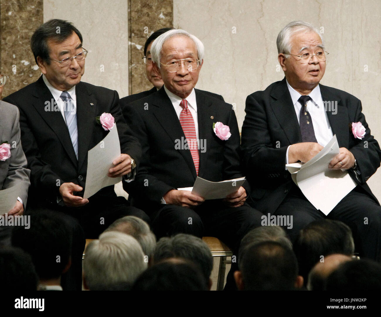 TOKYO, Japan - Japanese business leaders (From L to R) -- Masamitsu ...