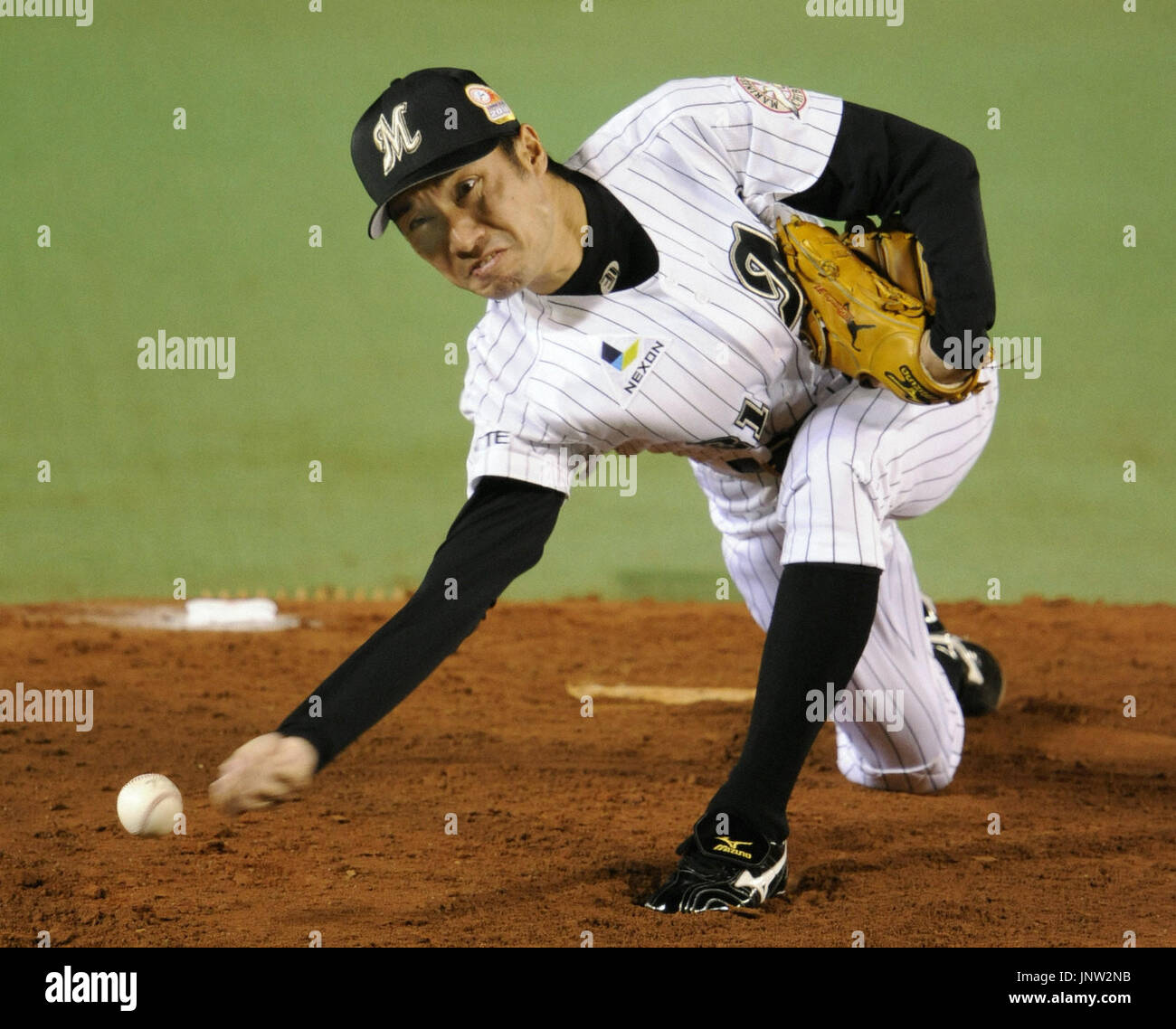 CHIBA, Japan - Lotte Marines starting pitcher Shunsuke Watanabe throws against the Chunichi ...