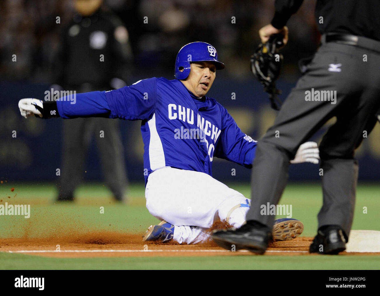 CHIBA, Japan - Chunichi Dragons third baseman Masahiko Morino slides ...