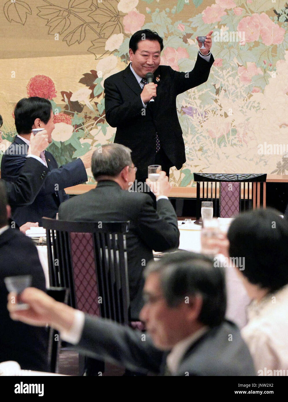 KYOTO, Japan - Japanese Finance Minister Yoshihiko Noda (standing), who ...