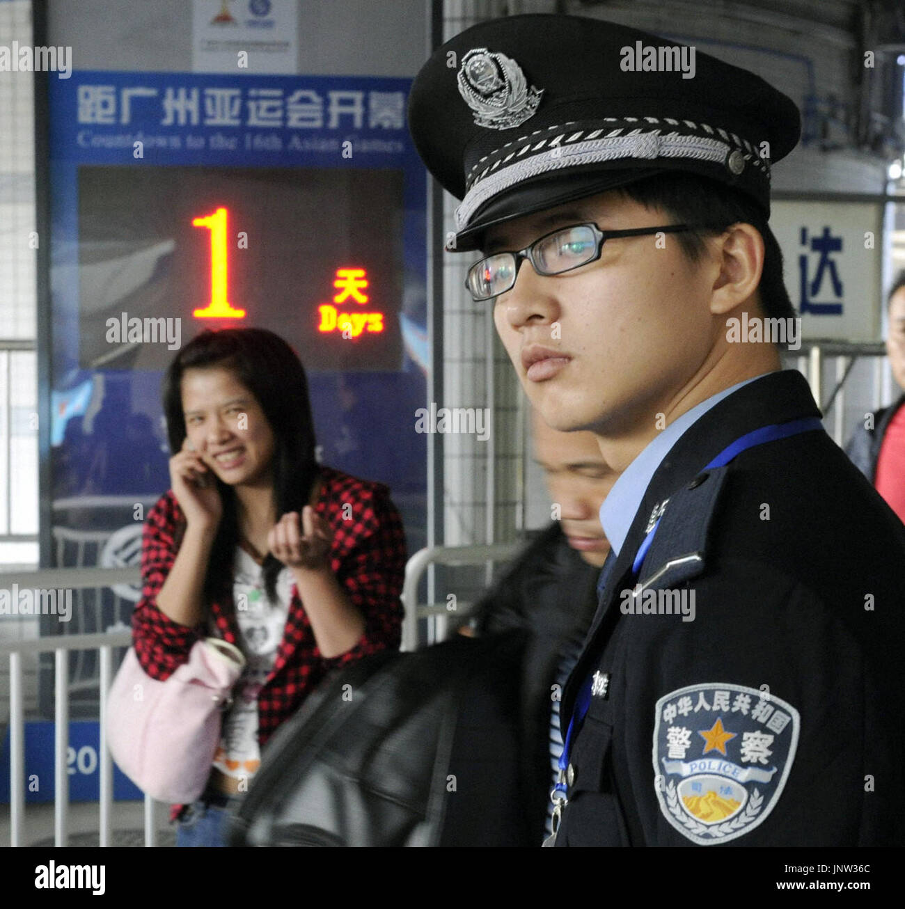 GUANGZHOU, China - A police officer patrols East Guangzhou station in ...