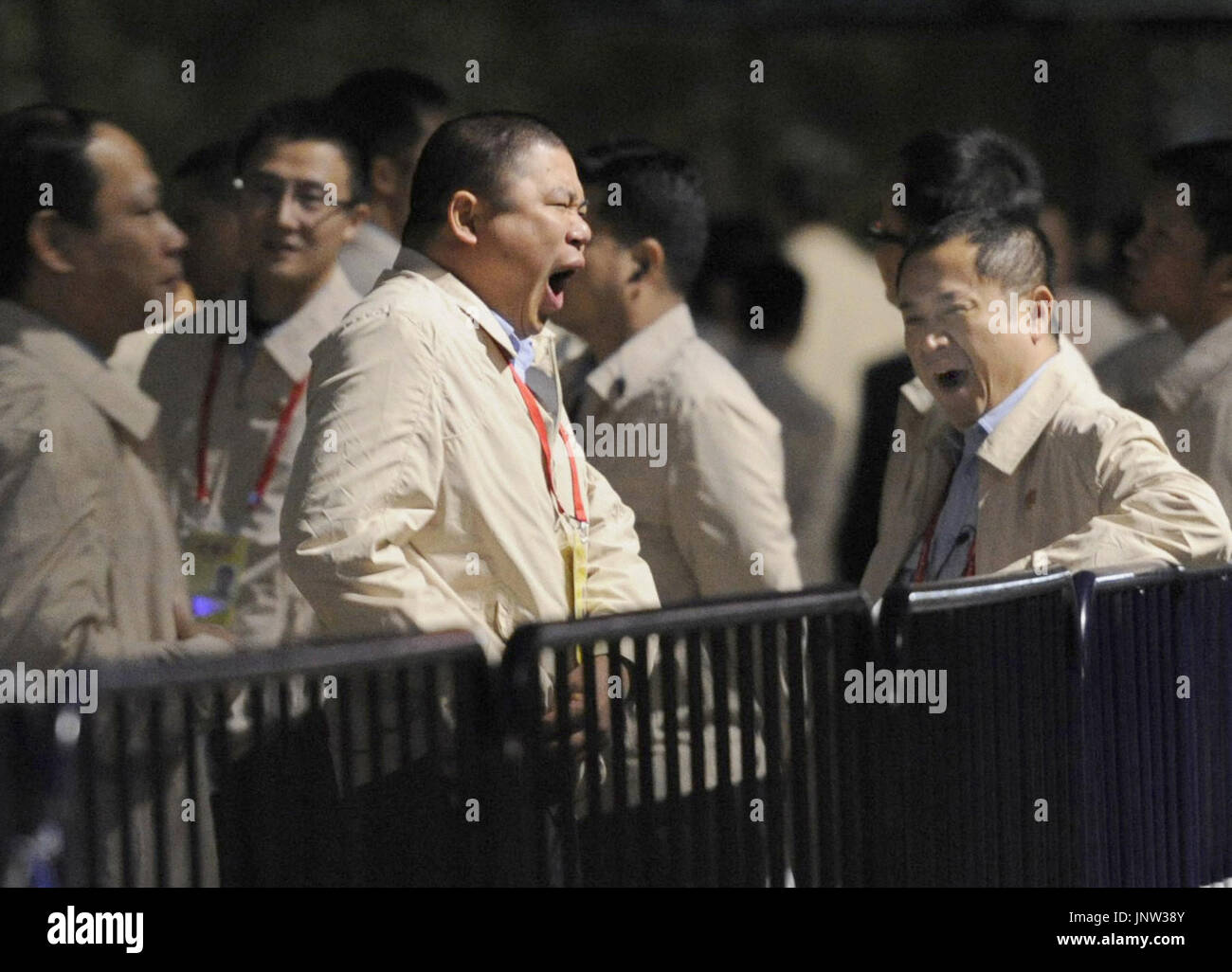 GUANGZHOU, China - Security guards yawn during a predawn meeting near ...