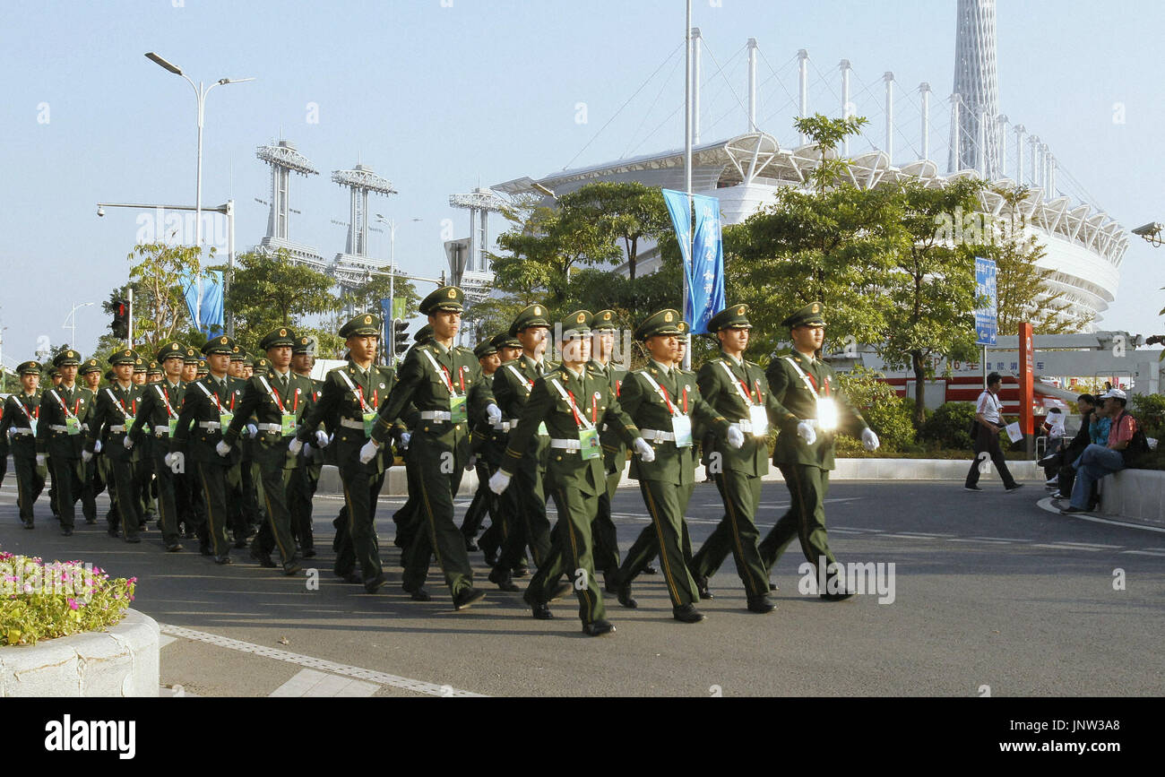 GUANGZHOU, China - Armed police officers march on the streets near the ...
